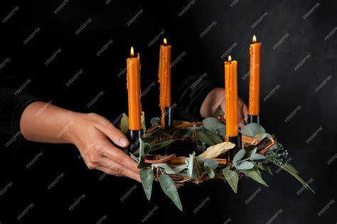 Free Photo Hands Holding Advent Wreath