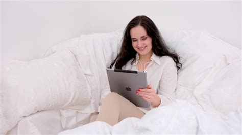 Beautiful Modern Woman Using Tablet Computer In Luxury Bedroom Stock Video At Vecteezy
