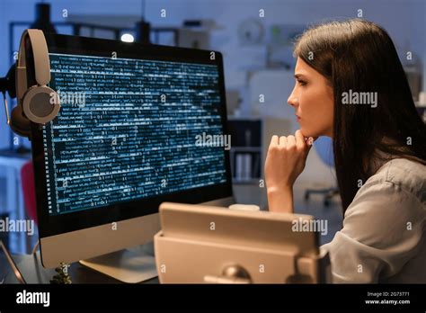 Female Programmer Working With Computer In Office At Night Stock Photo Alamy