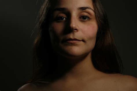 Premium Photo Portrait Of Woman Against Black Background
