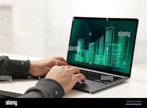 building information modeling man working at laptop indoors closeup digital project on