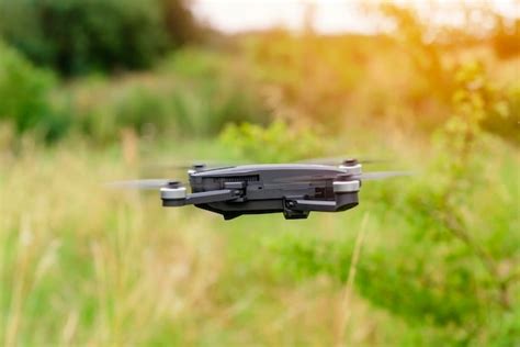 Premium Photo Man Using A Drone Making Photos And Videos Having Fun