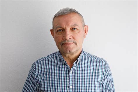 Premium Photo Portrait Of A Grayhaired Elderly Man In A Blue Shirt