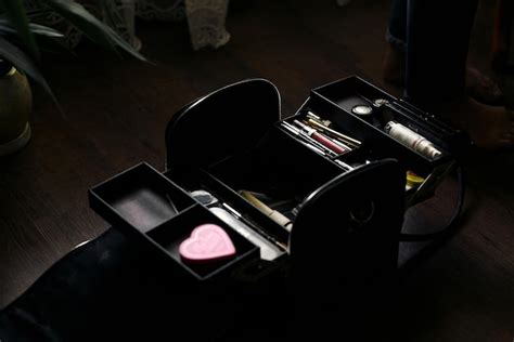 Premium Photo Beautician Bag Full Of Make Up Cosmetics Cosmetician Case On Wooden Table Makeup