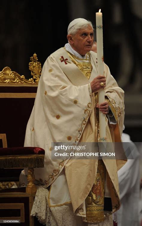 Pope Benedict Xvi Holds A Candle During Easter Vigil Mass In St News