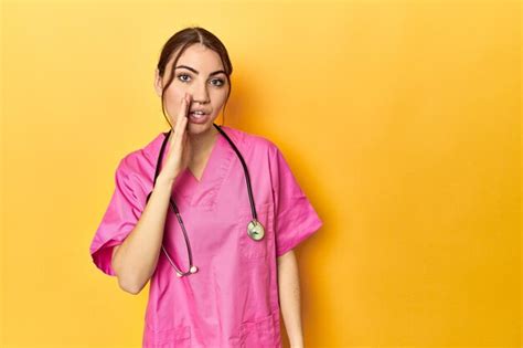 Premium Photo Nursing Assistant In Yellow Background Is Saying A