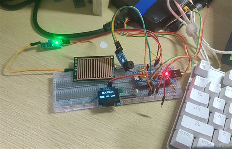 stm32单片机 雨滴传感器 oled屏幕 蜂鸣器报警 雨滴数据发送到串口调试助手 源代码 雨滴传感器电路图与32单片机连接 csdn博客