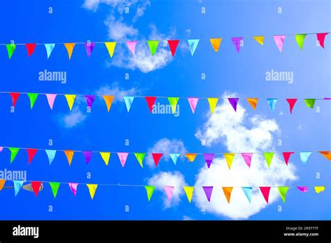 Bright Colorful Triangle Flags On Bright Blue Background Summer