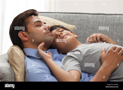 Father And Son Sleeping On Sofa Stock Photo Alamy
