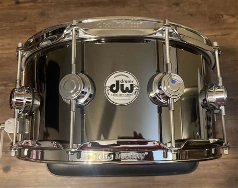 Dw Collectors Series 65x14 Black Nickel Over Brass Snare Reverb