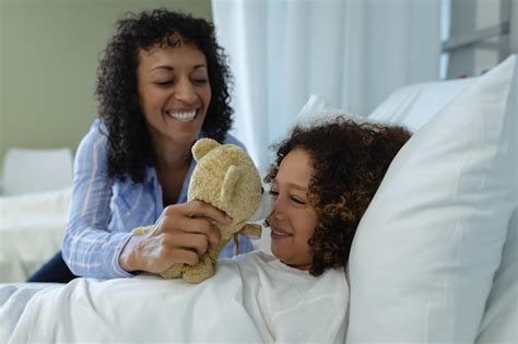 Premium Photo Mother And Son Playing Together In The Ward At Hospital