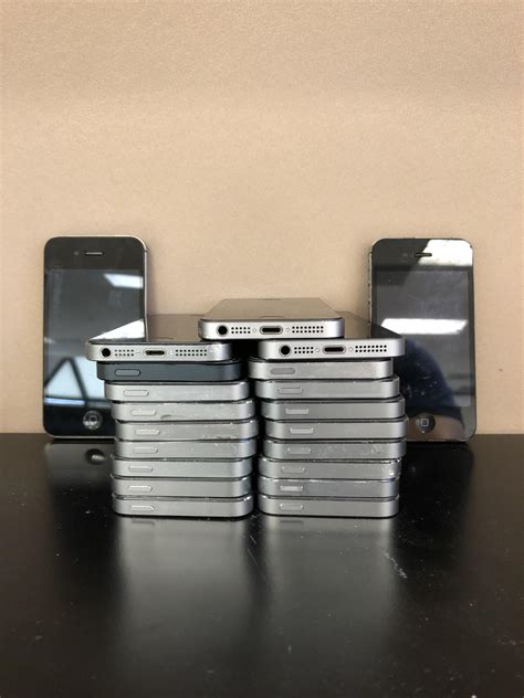 stack of never to be used again iphone 5s s and 2 iphone 4s s r iphone