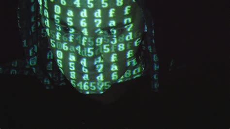 Male Face Of Hacker With Binary Code Projections Source Code Projected Over An Angry Stock Footage
