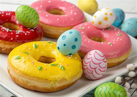 Brightly Glazed Donuts With Playful Easter Egg Decor Background Donuts