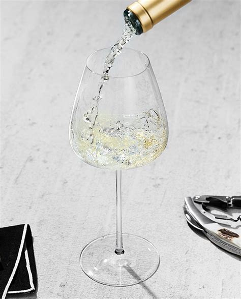 How To Hold A Wine Glass Properly And Why It Matters Wine Enthusiast
