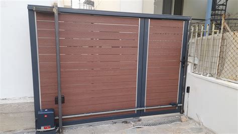 Συρόμενη γκαραζόπορτα με επέκταση πόρτα πεζών στην Αργυρούπολη