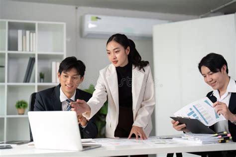 Team Engagement And Analysis Professionals Collaborating On Business Strategies Using Digital