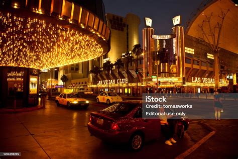 Old Lady Geting Out Of Car At Vibrant And Illuminated Las Vegas Street