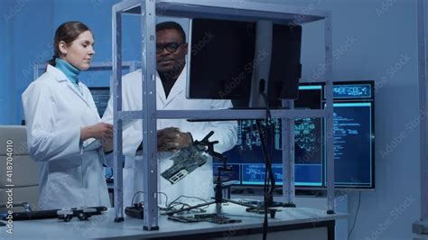 diverse team of microelectronic engineers discuss current developments