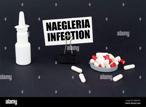 Medical Concept On The Black Surface Of A Pill A Nasal Spray And A