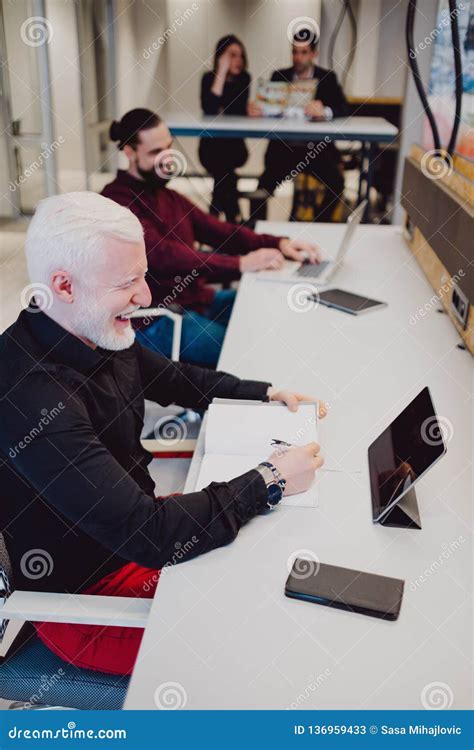 Colleagues Laughing In The Office While Working Stock Image Image Of Female People 136959433