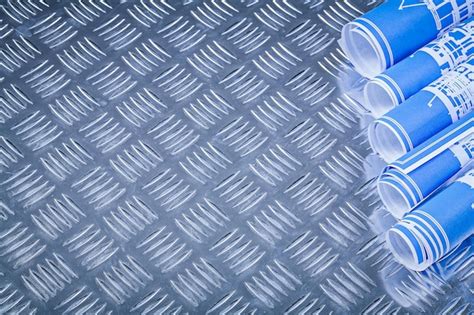 Premium Photo Blue Construction Plans On Fluted Metal Background Copy