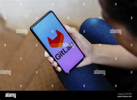 In This Photo Illustration The Gitlab Logo Is Displayed On A