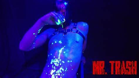 Masked Man Plays With The Hot Wax On The Metal Trunk With The Oiled