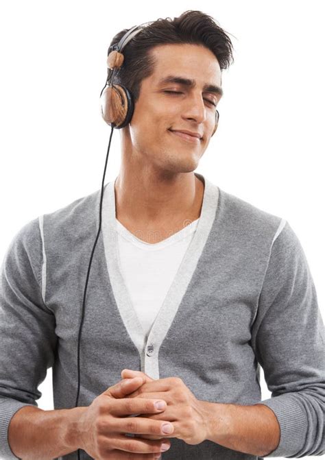 He Loves The Music A Handsome Young Man Listening To Music On His