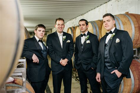 Groomsmen In Black Tuxedos Groom In A White Bow Tie
