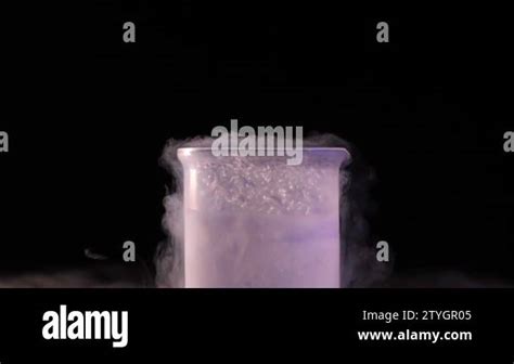 Man Puts His Hand In Container With Liquid Nitrogen Concept Of Chemical Experiments And Tests