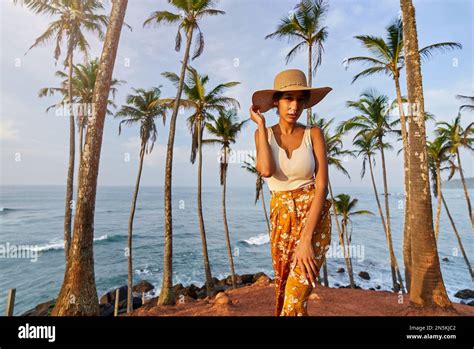 Young African Female Model Posing In Colorful Clothes At Tropical
