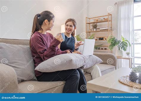 Two Women Communicate With Friends And Classmates Via Video Link Using