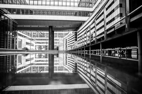 Premium Photo Reflection Of Building In Reflecting Pool