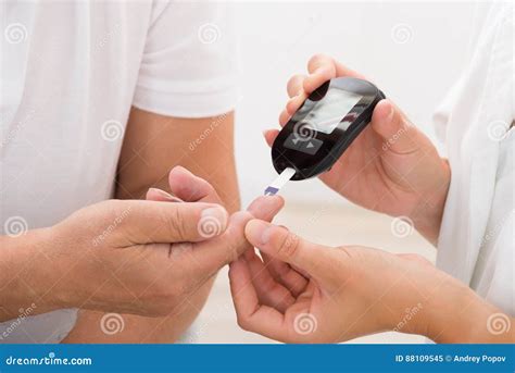 Doctor Using Glucometer On Patient`s Finger Stock Image Image Of