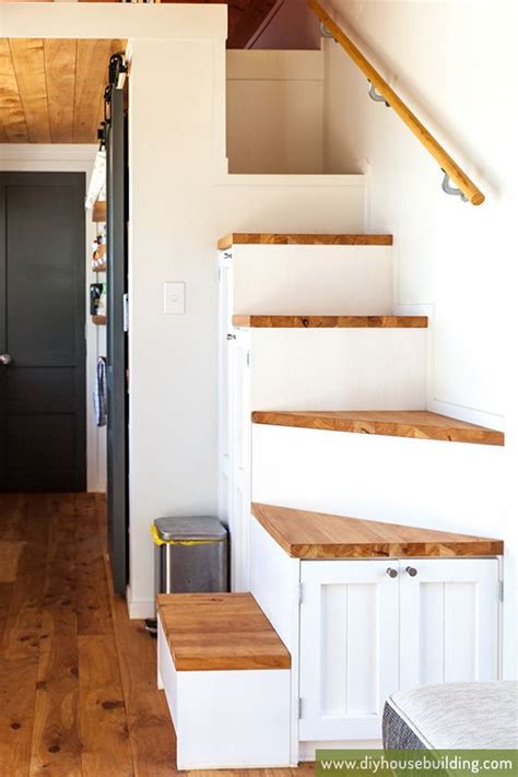 Stairs Leading Up To The Second Floor In A Home With Wood Floors And