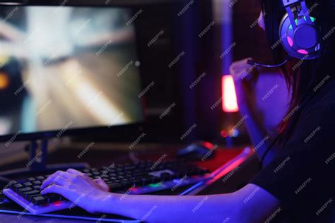 Premium Photo Female Cyber Hacker Gamer Watching Monitor And Making