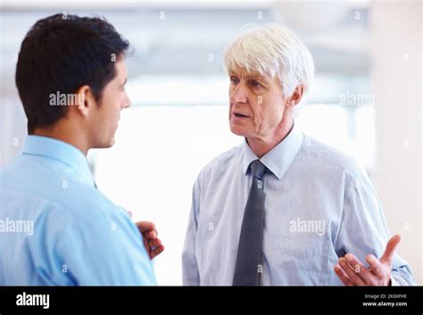Business Men In Serious Conversation Portrait Of Successful Business