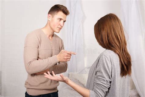 A Girl Spreads Her Hands In A Tilted Head On A White Isolated