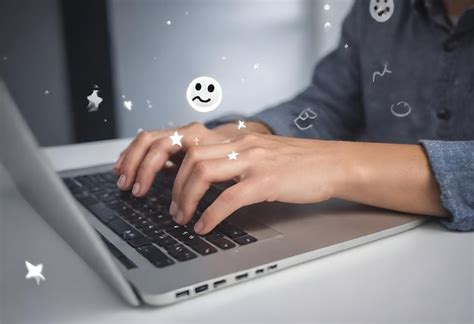 Premium Photo A Persons Hands Typing On A Laptop Keyboard With Graphical Overlay Of Emoticons