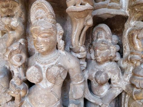 Statue Of A Woman Holding A Vase From Stone Carved Erotic Bas Relief In Hindu Temple In