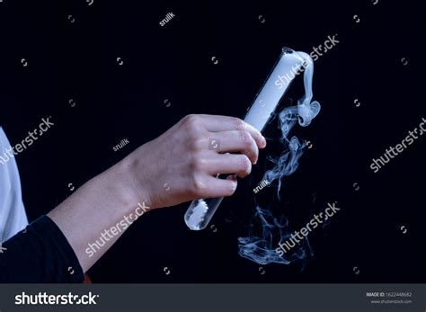 Closeup Hand Holding Cylinder Chemical Reaction Stock Photo