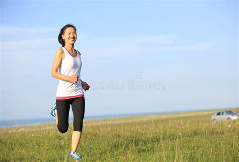 Runner Athlete Running On Grass Seaside Stock Image Image Of Flower