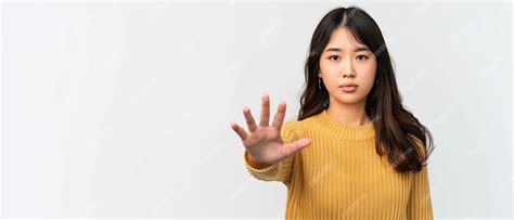 Premium Photo Empowering Asian Woman Asserting Boundaries With A Stop