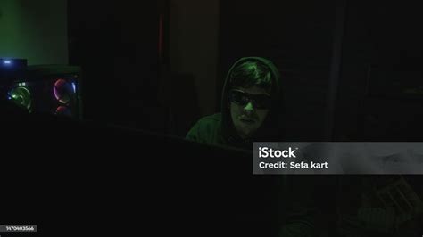 Glasseswearing Hacker Hacking At Computer Green Light Ambiance Stock
