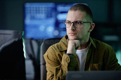 Portrait Of Male Software Developer Thinking Over Code Problem While