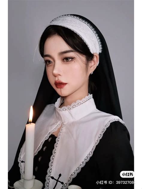 A Woman With A Candle In Her Hand And Wearing A Nuns Headdress