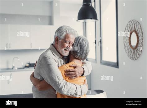 Laughing Grey Haired Husband And Wife With Closed Eyes Hi Res Stock