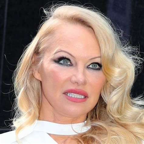 Pamela Anderson Is A Goddess In All White Knit Dress As She Steps Out