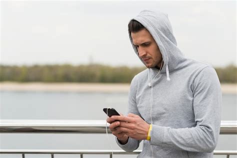 Free Photo Portrait Of Adult Male Checking His Mobile Phone